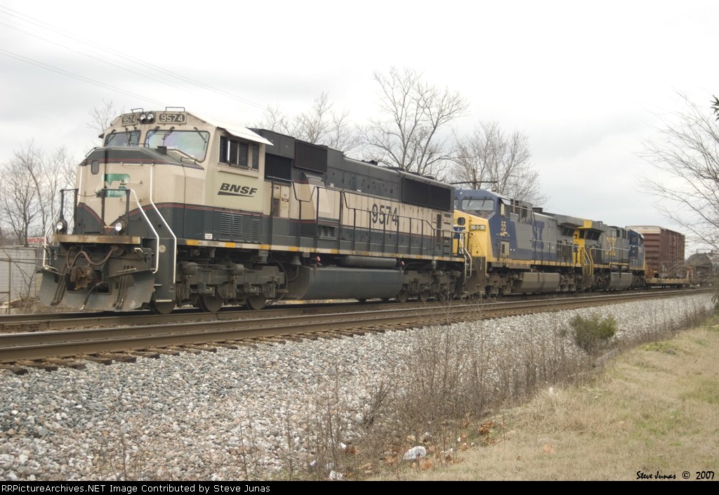 BNSF 9574 sits in the siding waiting for clear track